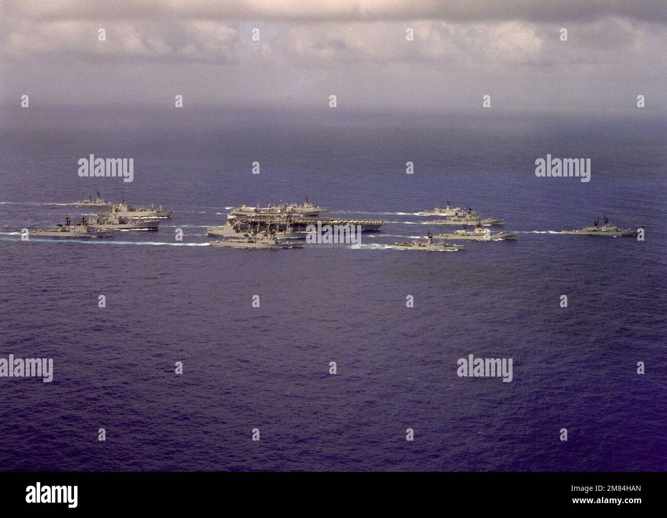 An aerial view of the aircraft carrier USS KITTY HAWK (CV-63) and other ...