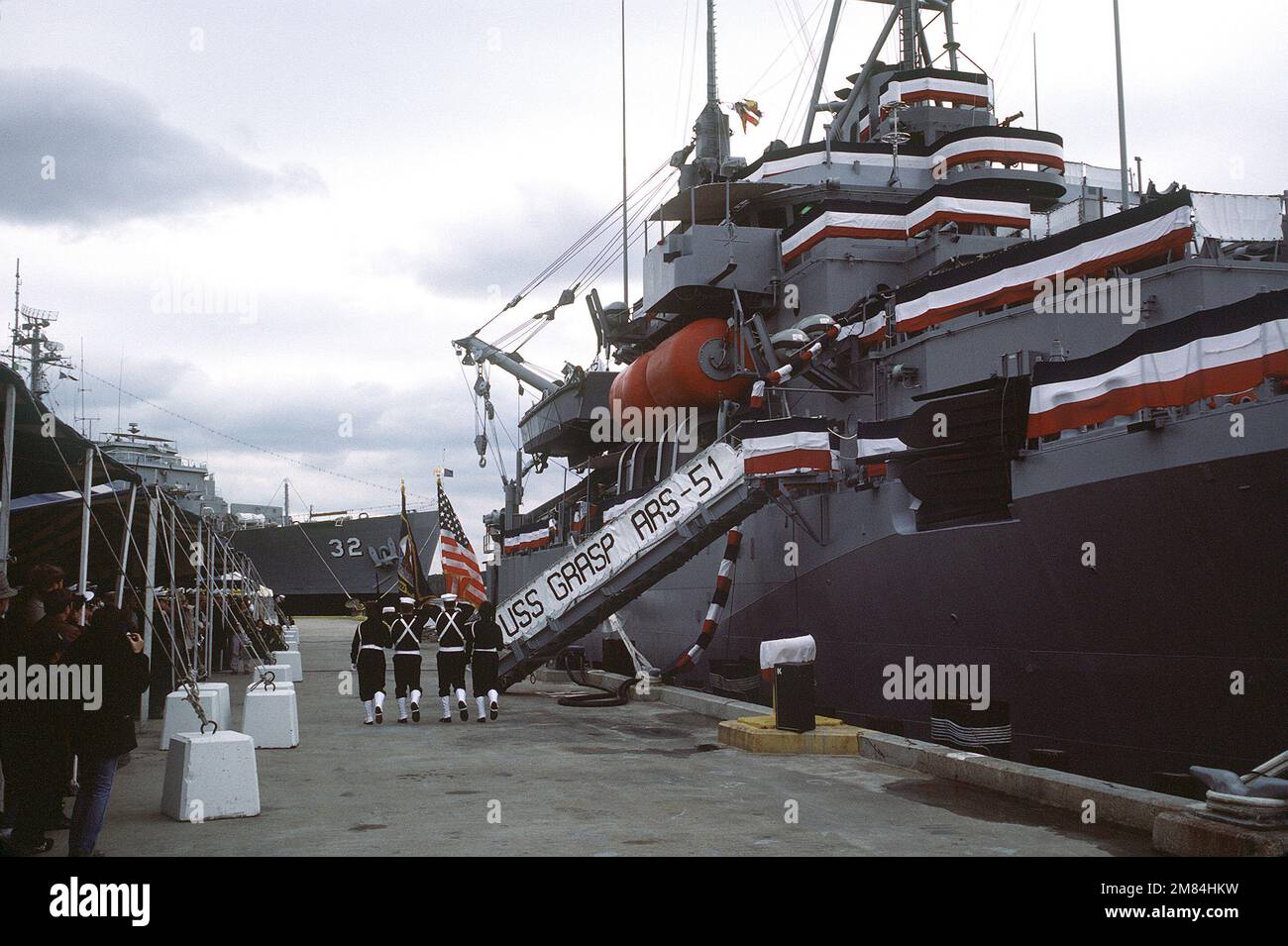 A U.S. Navy color guard parades the colors during the commissioning of ...