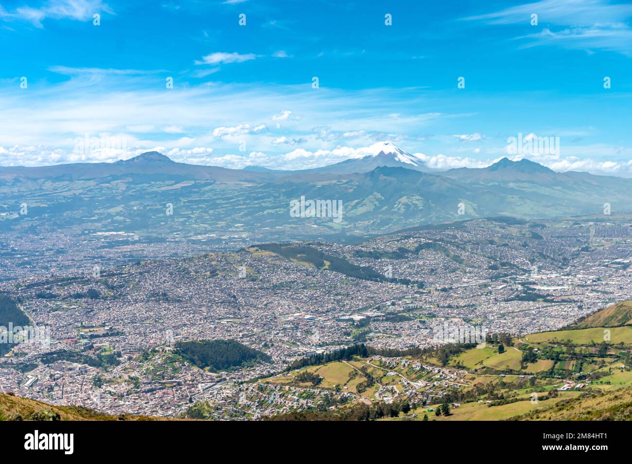 View of volcanoes and mountains above the city of Quito in Ecuador ...