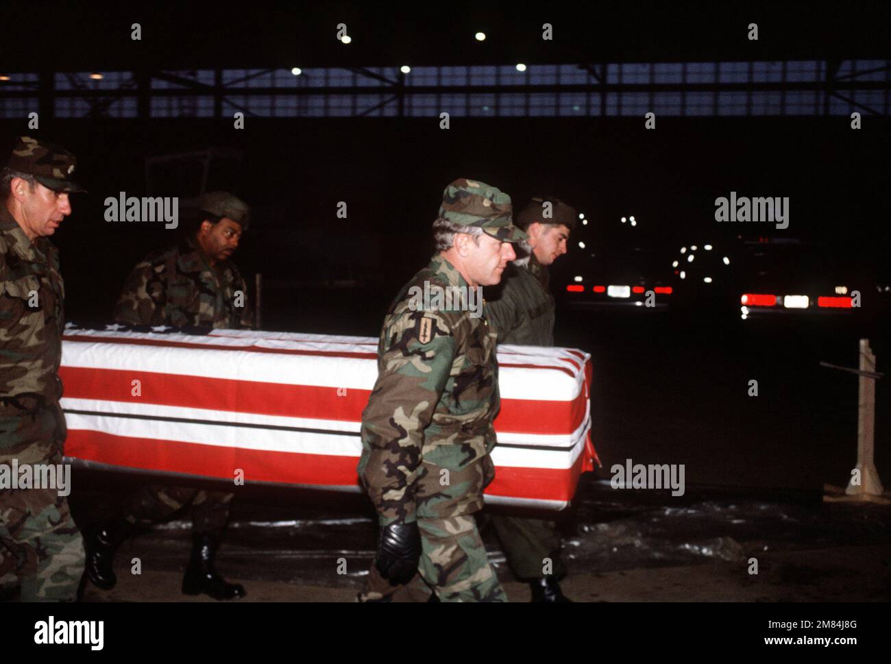 Members of the U.S. Army Combat Pictorial Detachment carry a casket ...