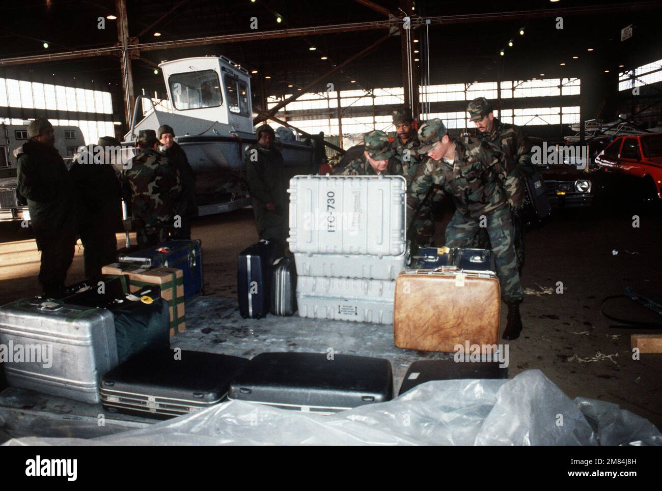 Members of the U.S. Army Combat Pictorial Detachment check their gear ...
