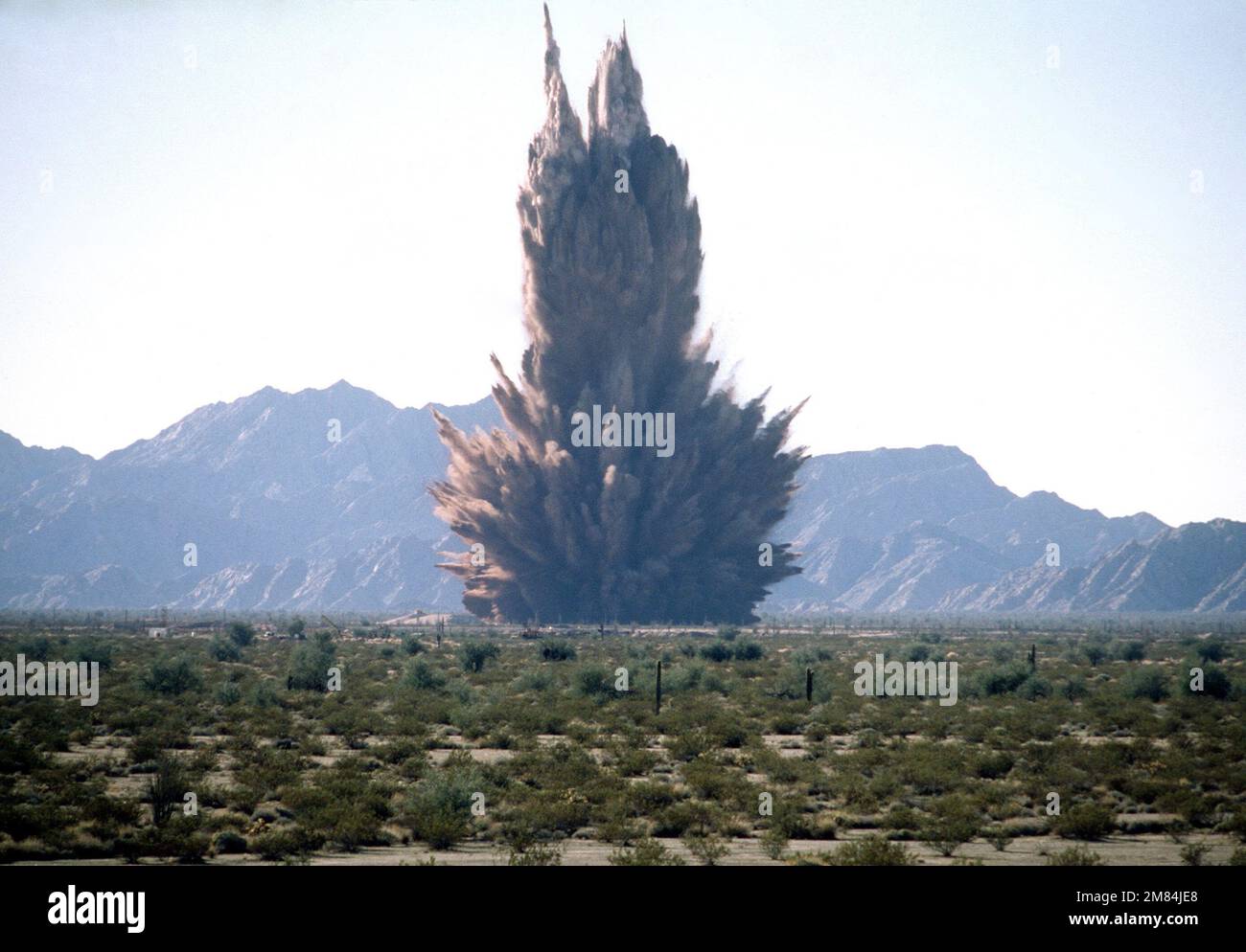 Smoke, dust and debris rise into the air as 80,000 pounds of high ...