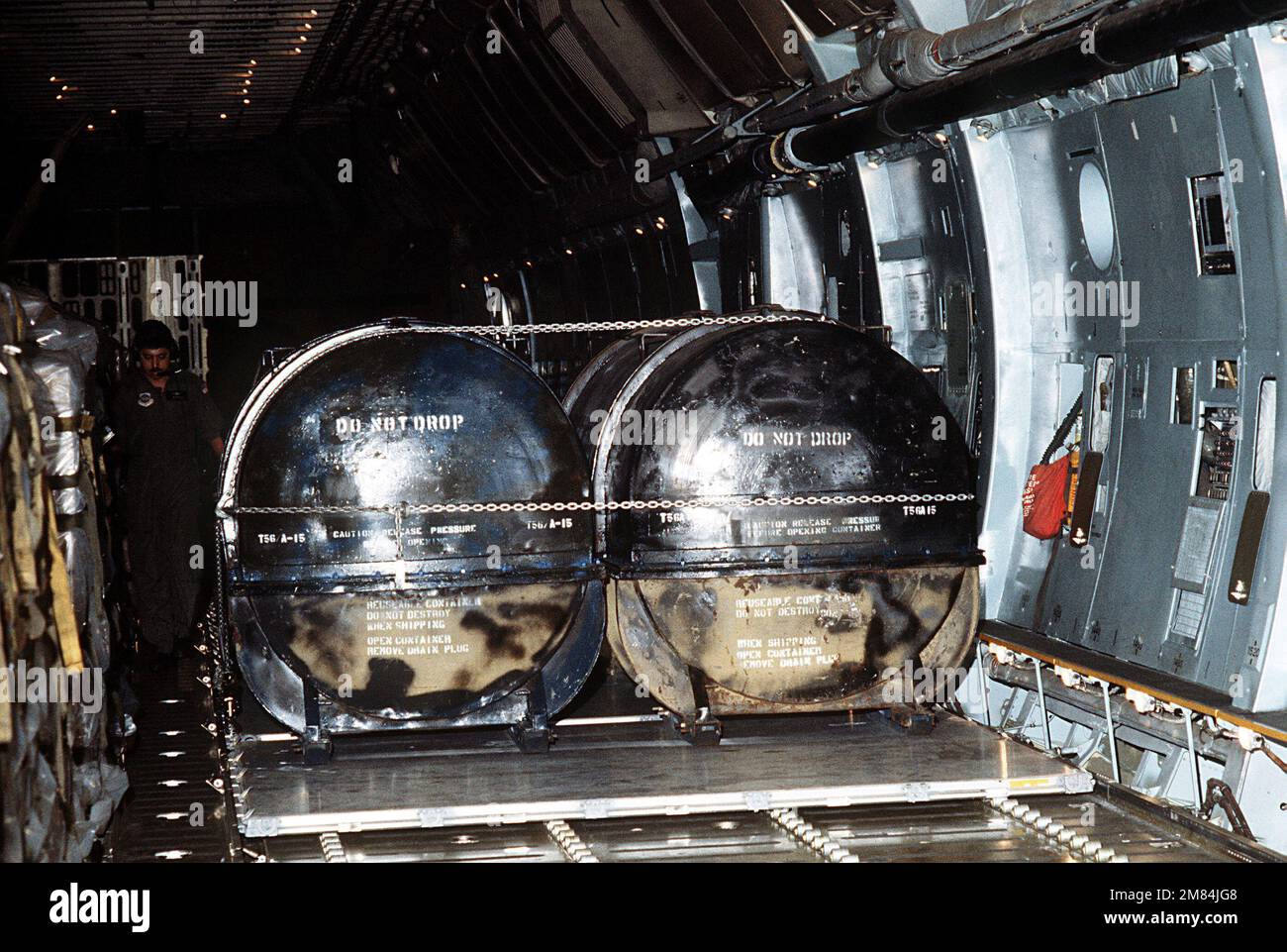 A 316th Aerial Port Squadron loadmaster prepares cargo for unloading ...