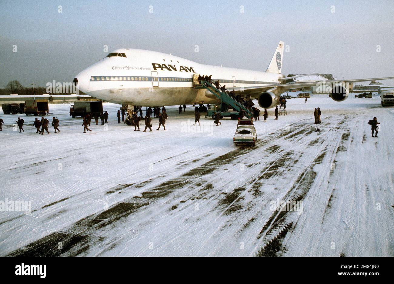 U.S. military personnel offload from a contract Pan American Airlines ...
