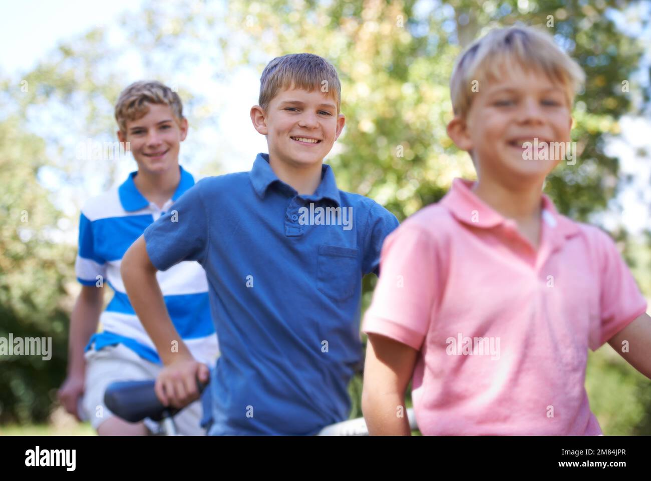 Out for an awesome bike ride. Three brothers out for a bike ride in the ...