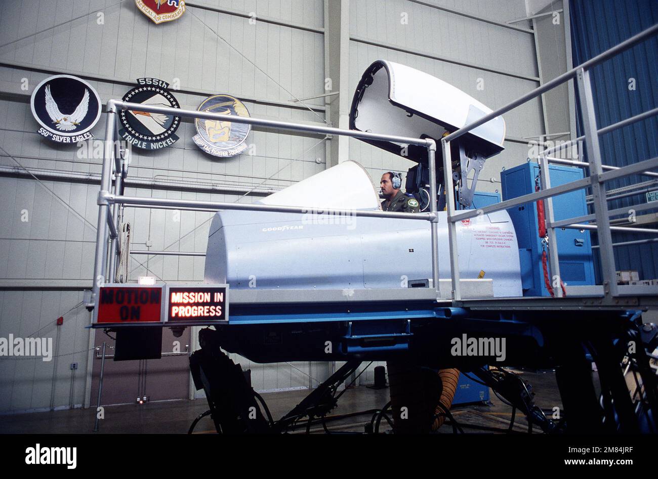 Pilot sits in F-4 Phantom simulator in the training section at Luke Air ...