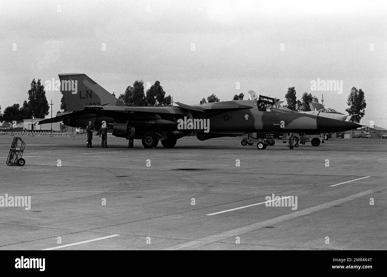 The crew of a U.S. Air Force F-111 aircraft conducts a check of their ...