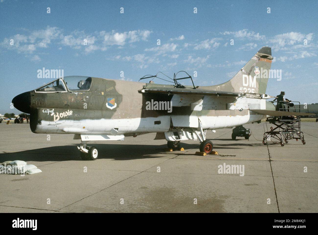 Workmen prepare an A-7 Corsair II aircraft so that the plane can be ...