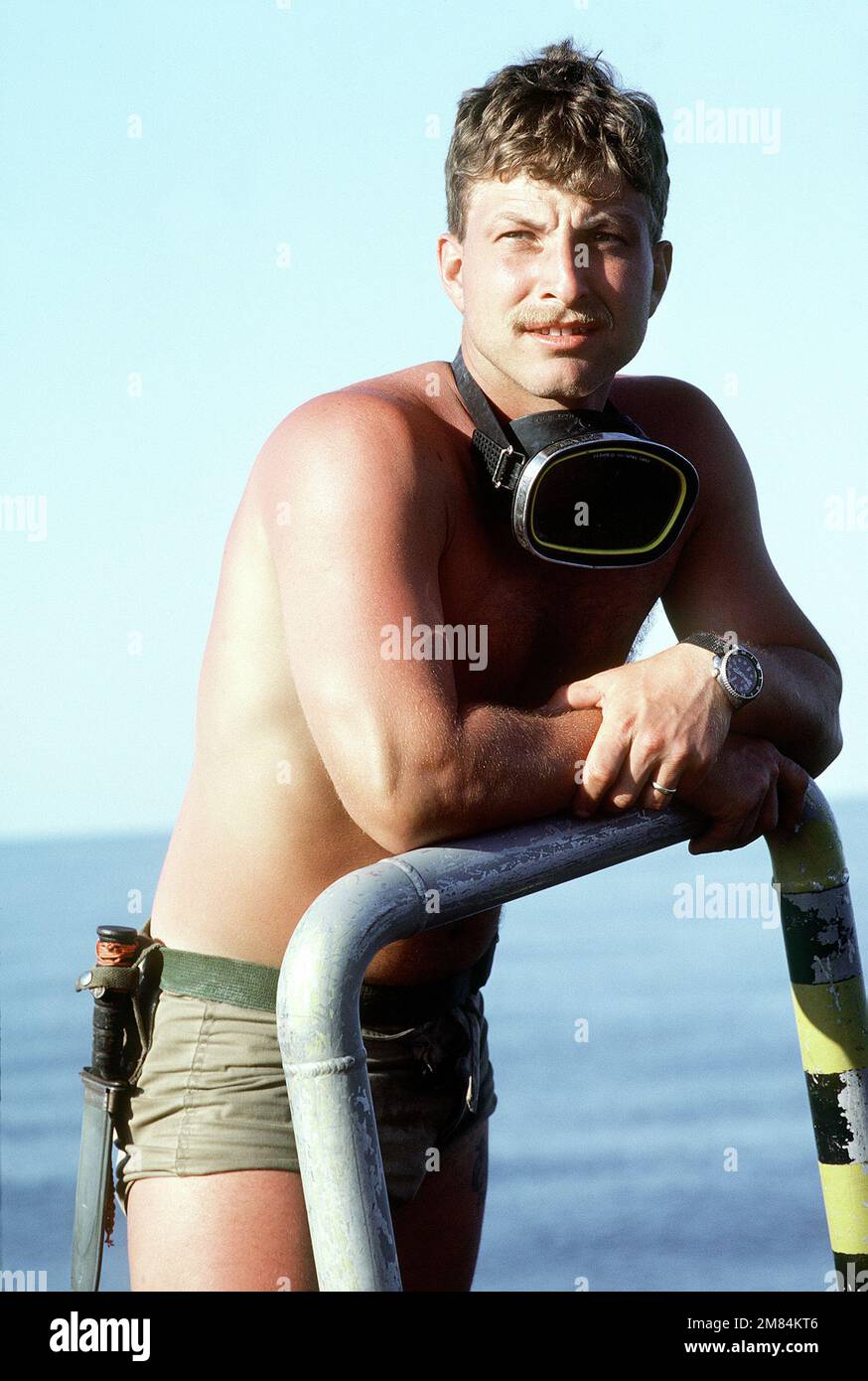 A diver stands by aboard the salvage ship USS PRESERVER (ARS-8) during ...
