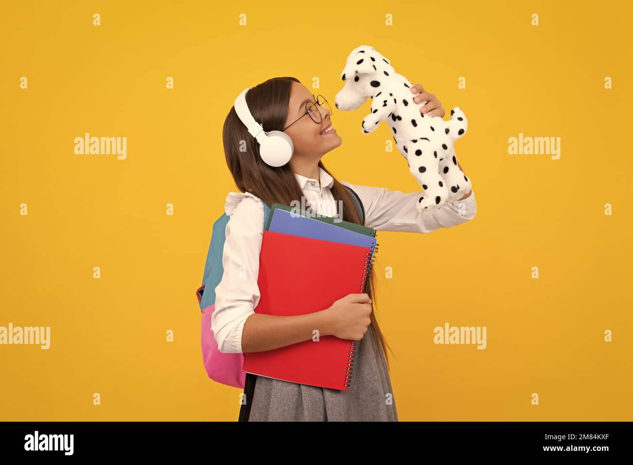 Funny school girl with toy. Happy childhood and kids education ...