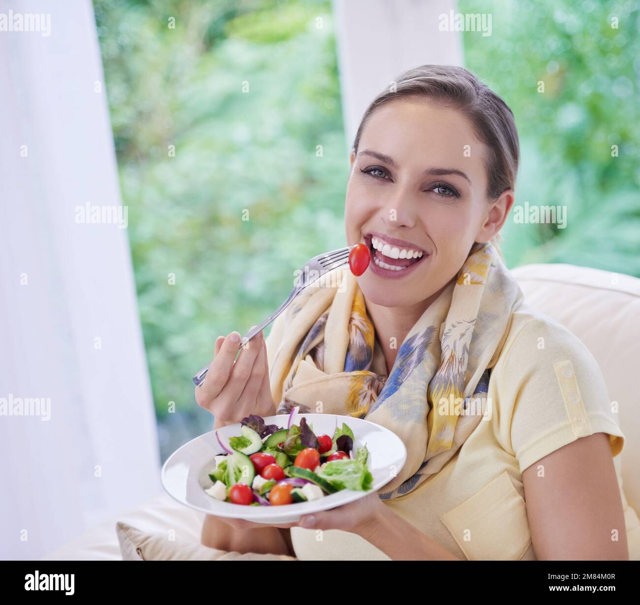 Eat healthy, be healthy. Portrait of a young woman enjoying her salad ...