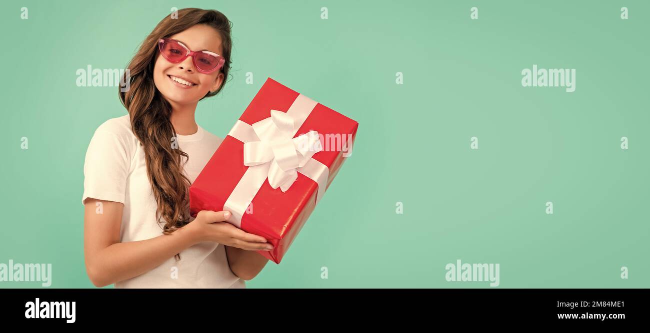 Teenager birthday. stylish teen girl in sunglasses hold giftbox ...