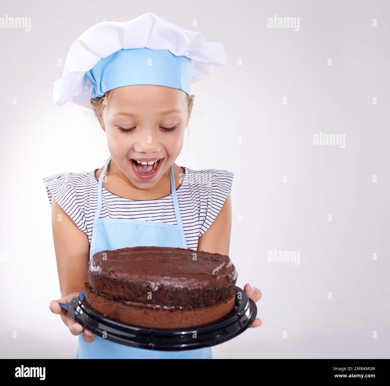 This is more delicious than it looks. Studio shot of a cute young girl ...
