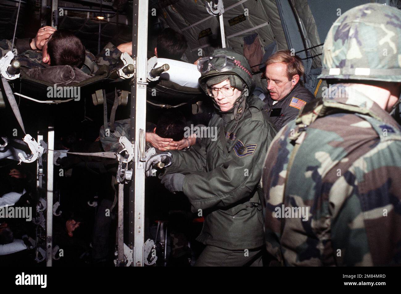 U.S. Army medical personnel and C-130 Hercules aircraft crew members ...