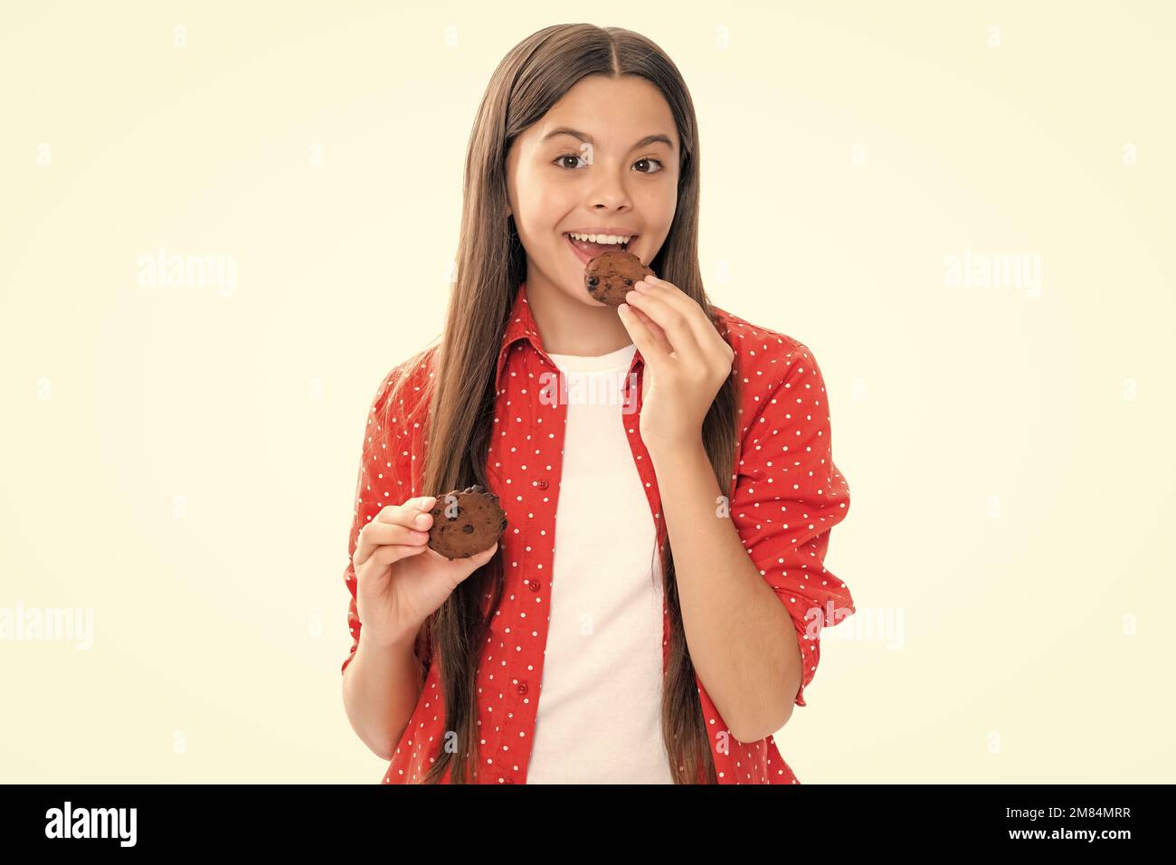 Teen girl eating cookies, happy childhood, food, sweets and bakery ...