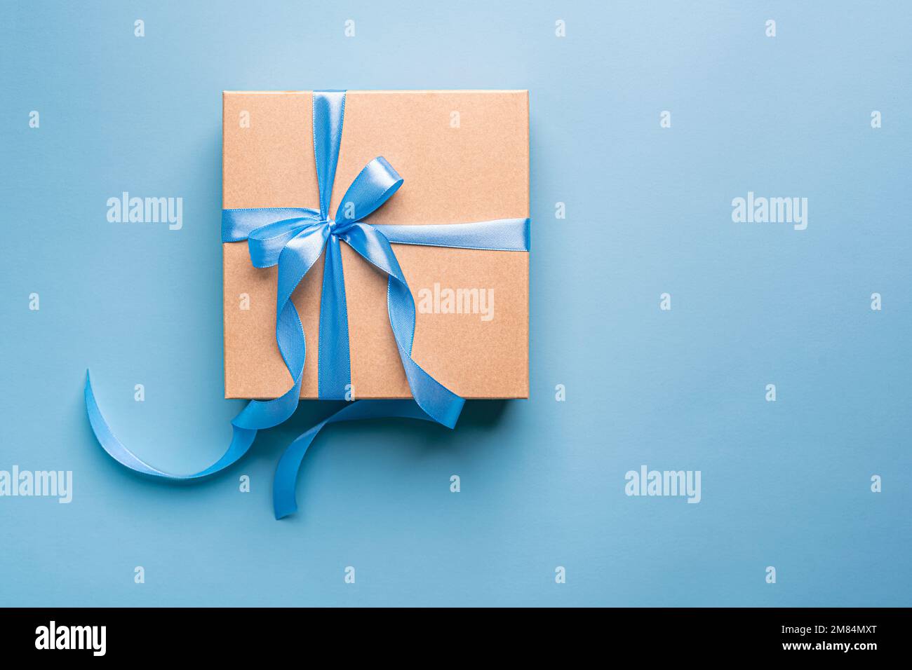 Stylish gift box on a blue background Stock Photo - Alamy