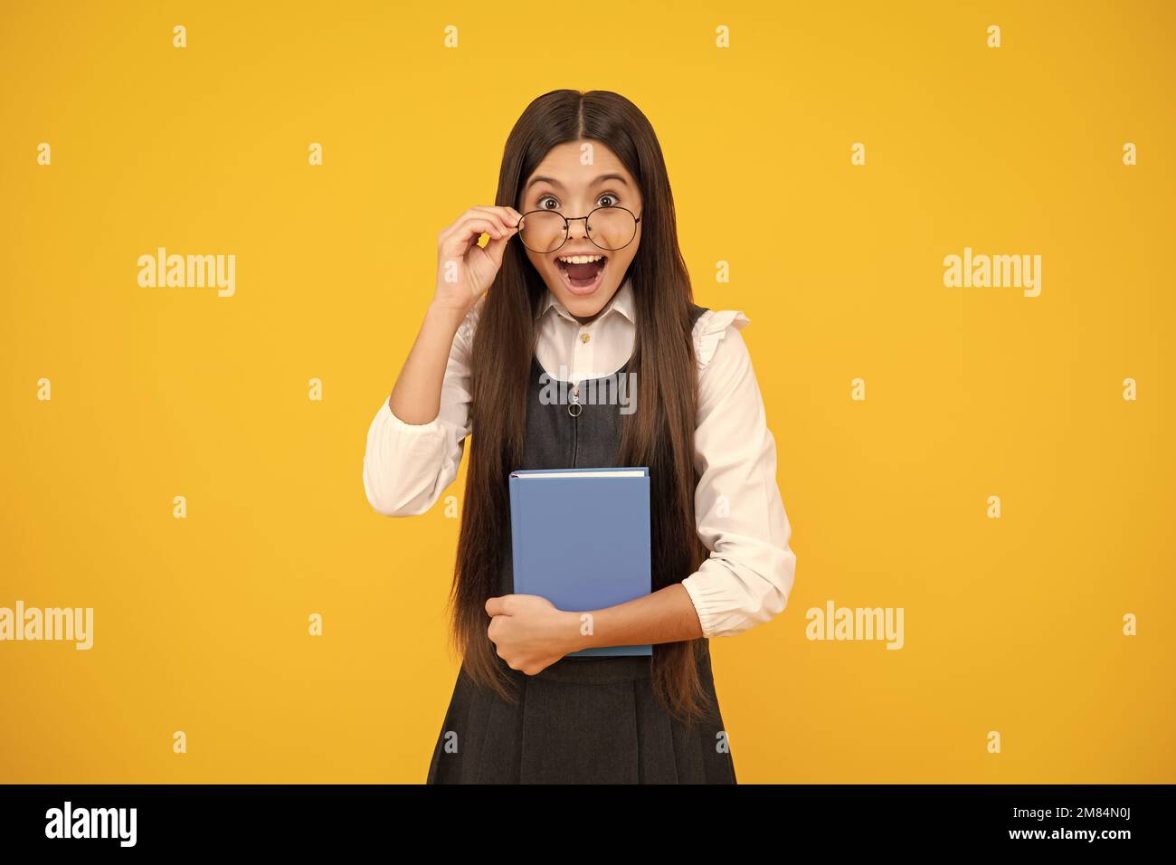 Teenage school girl with books. Schoolgirl student. Surprised face ...