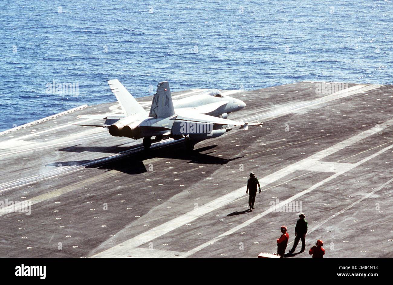 An F/A-18A Hornet aircraft from Strike Fighter Squadron 25 is launched ...