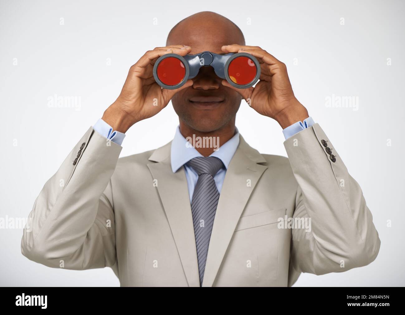 Great views. Attractive young man standing and looking through ...