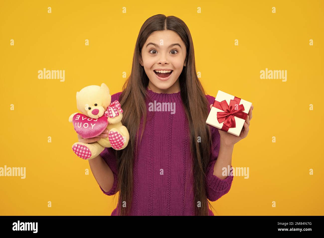 Teenager kid with present box. Teen child girl giving birthday gift ...