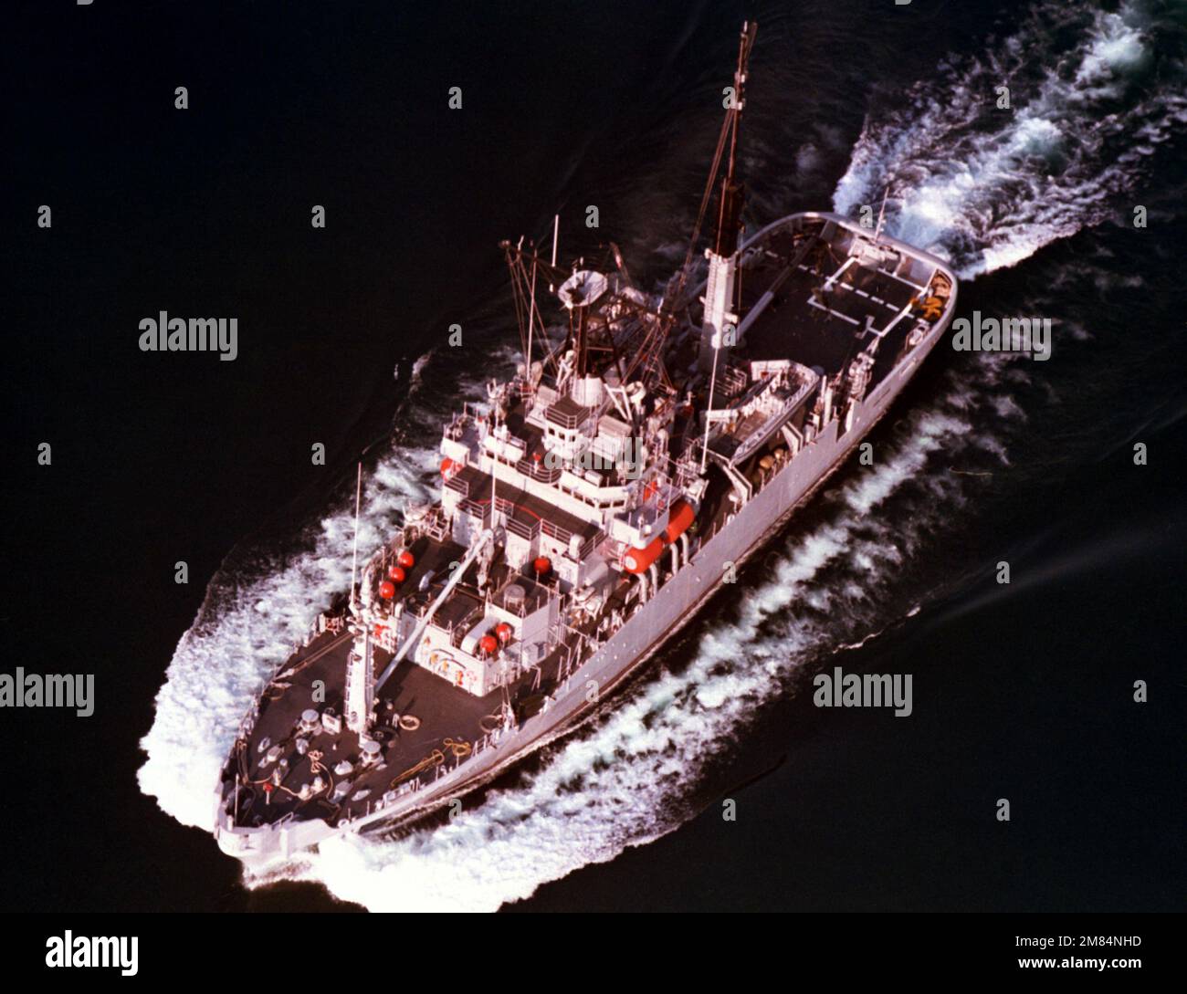 An elevated port bow view of the salvage ship USS SALVOR (ARS-52 ...
