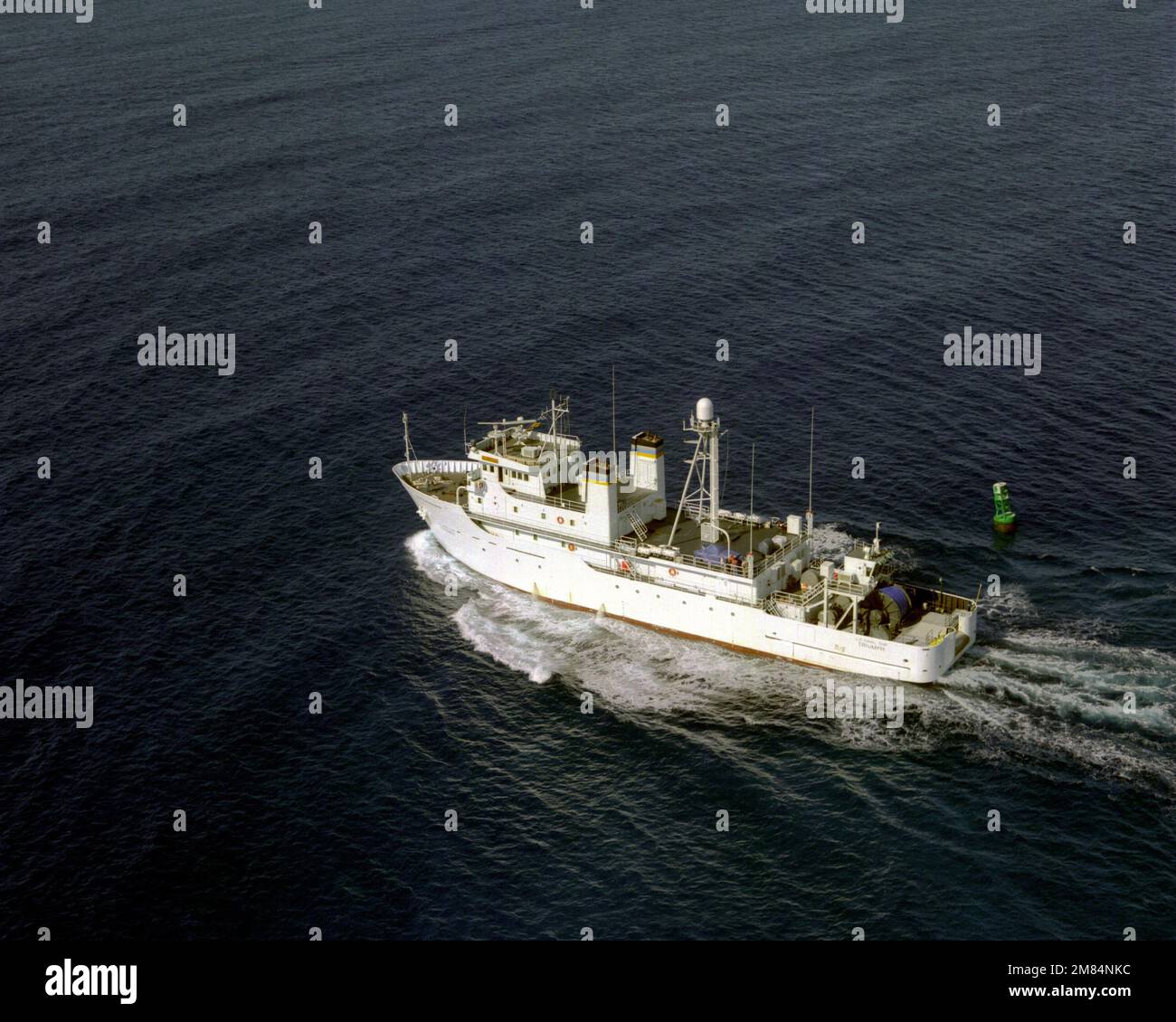 An evevated port quarter view of the ocean surveillance ship USNS ...