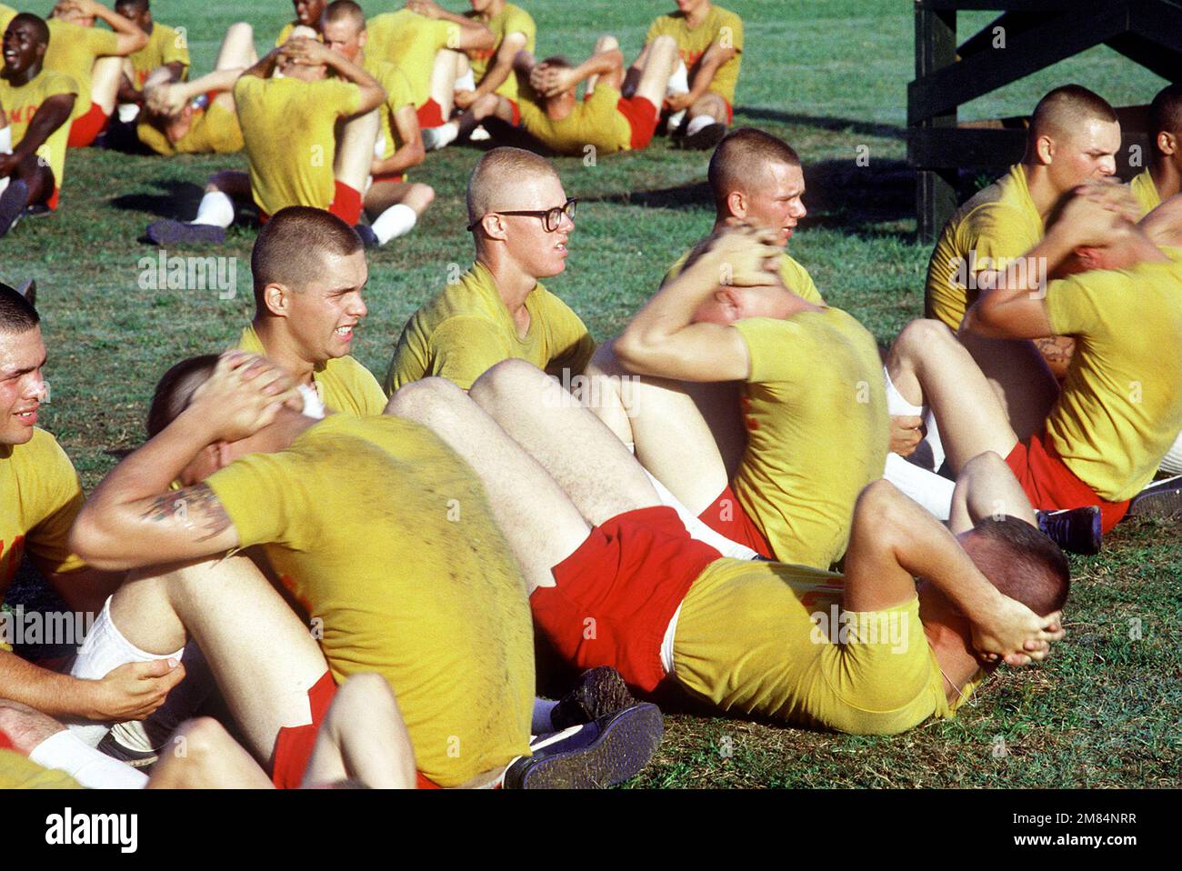 Marine recruits perform sit-ups during physical training at the Marine ...