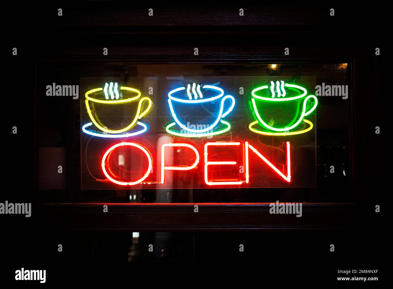Neon open sign with coffee cup on glass door. an open cafe Stock Photo ...