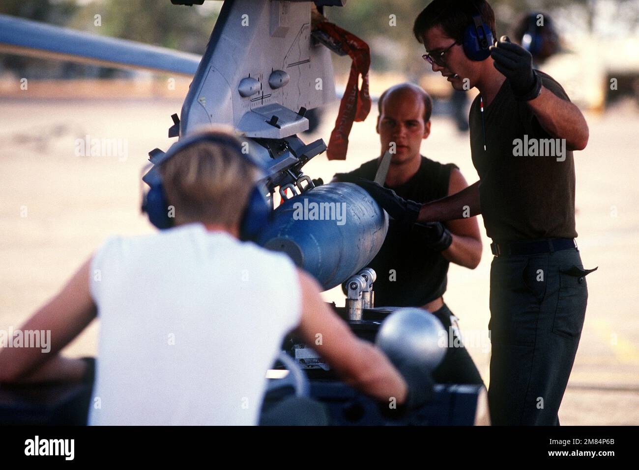 Members of the 432nd Aircraft Generation Squadron load Mark 82 500 ...