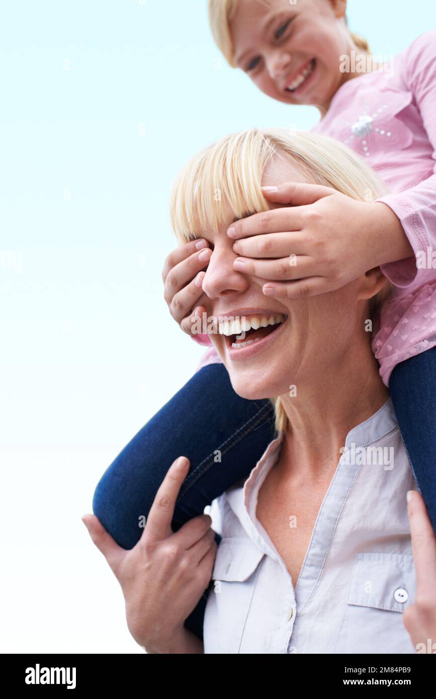 I will lead the way mom. A little girl covering her mothers eyes as she ...