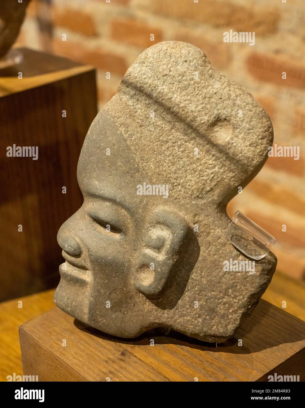 Ceremonial carved stone axe head in the shape of a man from the pre ...