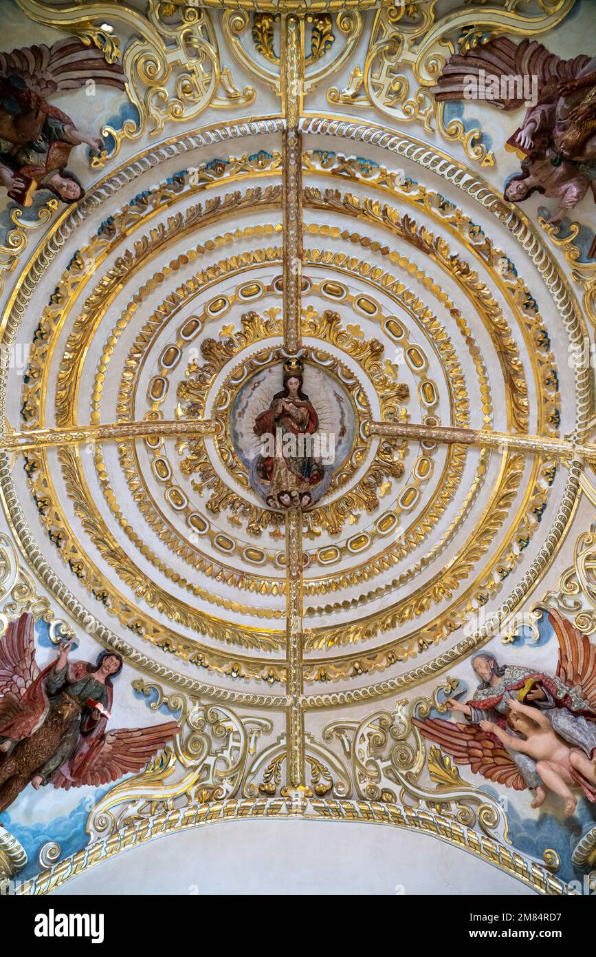 Ornately decorated ceiling dome with religious art in the former ...