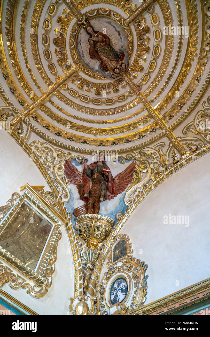 Ornately decorated ceiling dome with religious art in the former ...