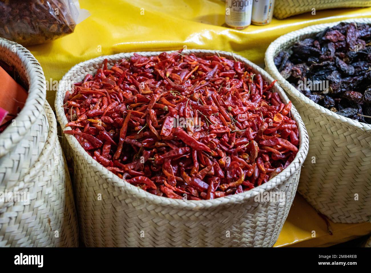 Baskets of chili peppers for sale in the Mercado Benito Juarez in the ...
