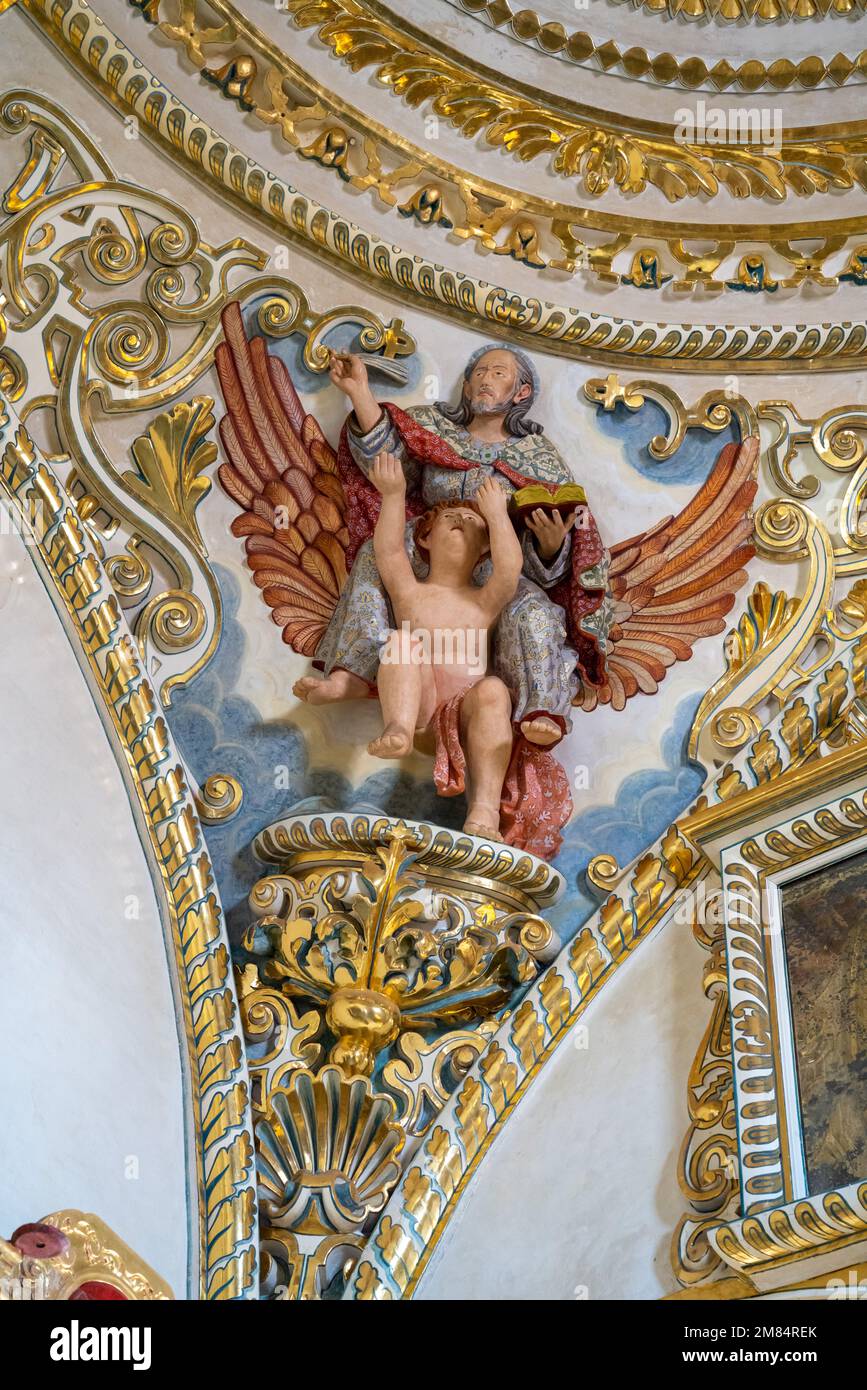 Ornately decorated ceiling dome with religious art in the former ...