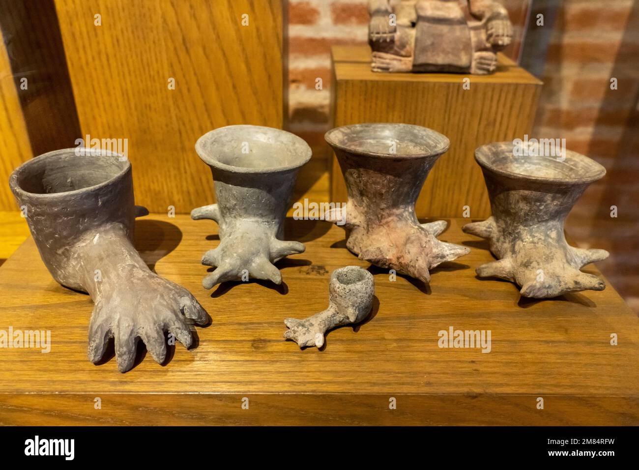 Pre-Hispanic ceremonial ceramic Zapotec urns in the form of jaguar feet ...