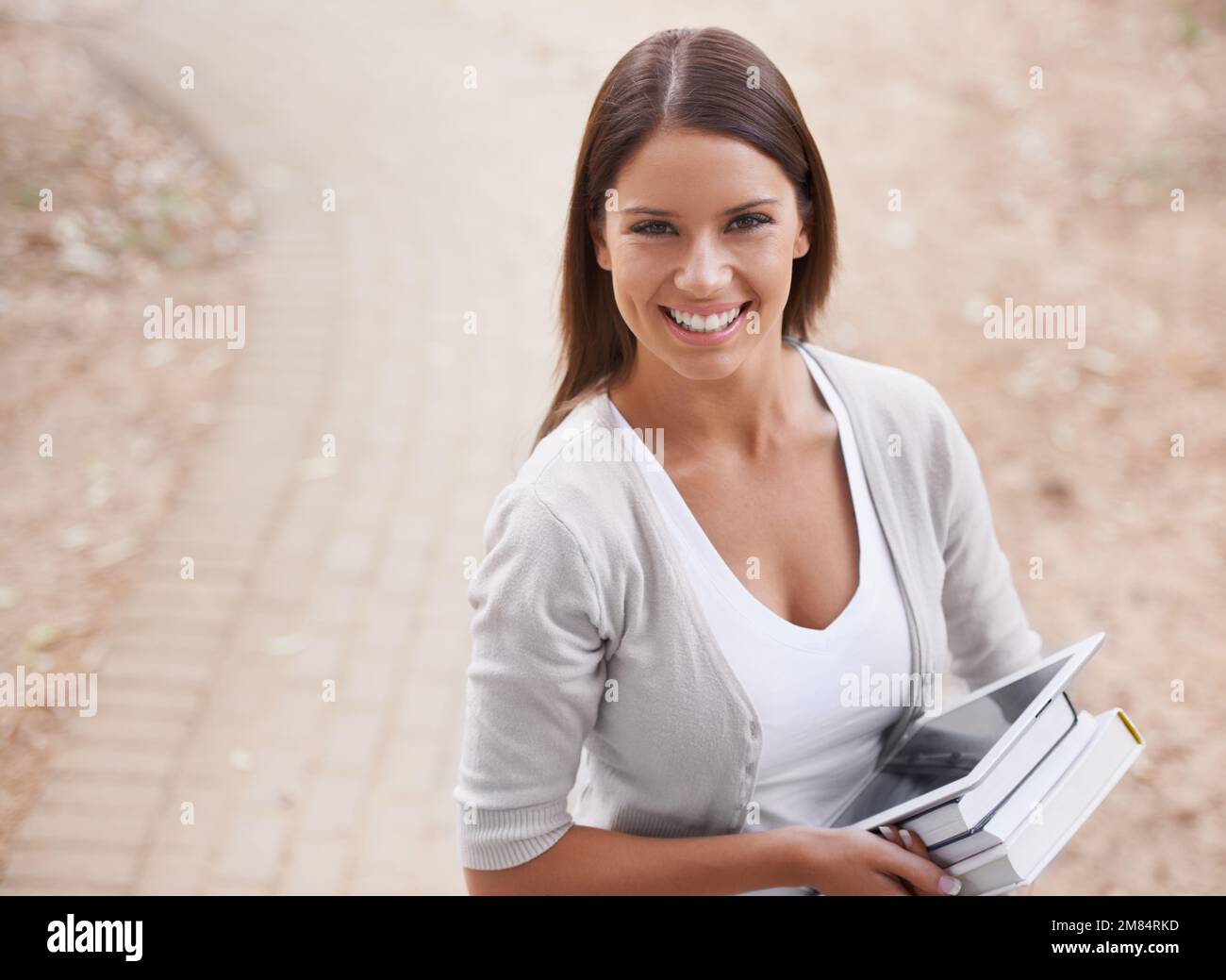 Woman holding books standing hi-res stock photography and images - Alamy