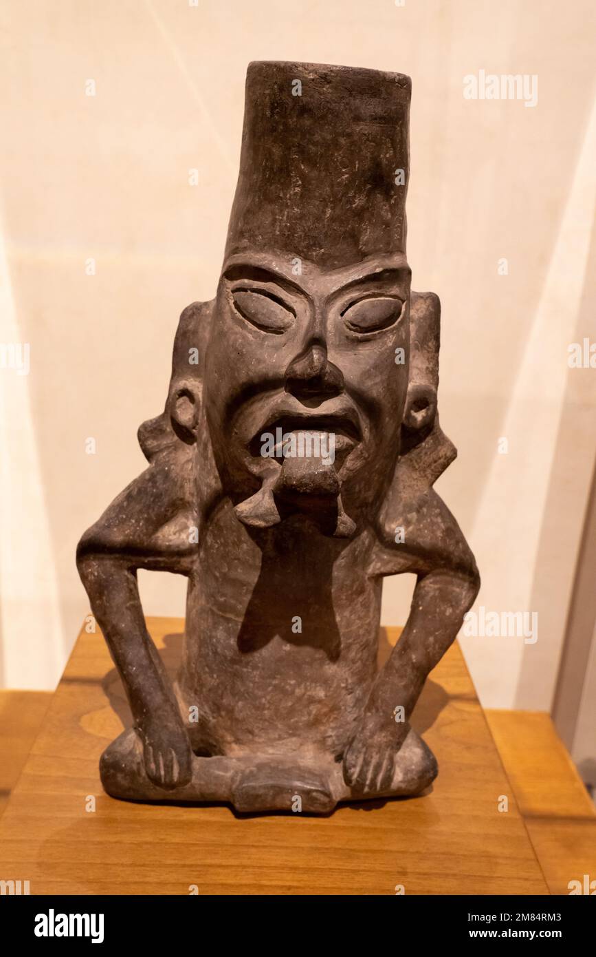 Pre-Hispanic ceramic Zapotec funerary pot in human shape with a bifid ...