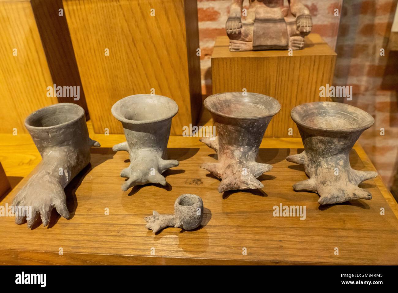 Pre-Hispanic ceremonial ceramic Zapotec urns in the form of jaguar feet ...