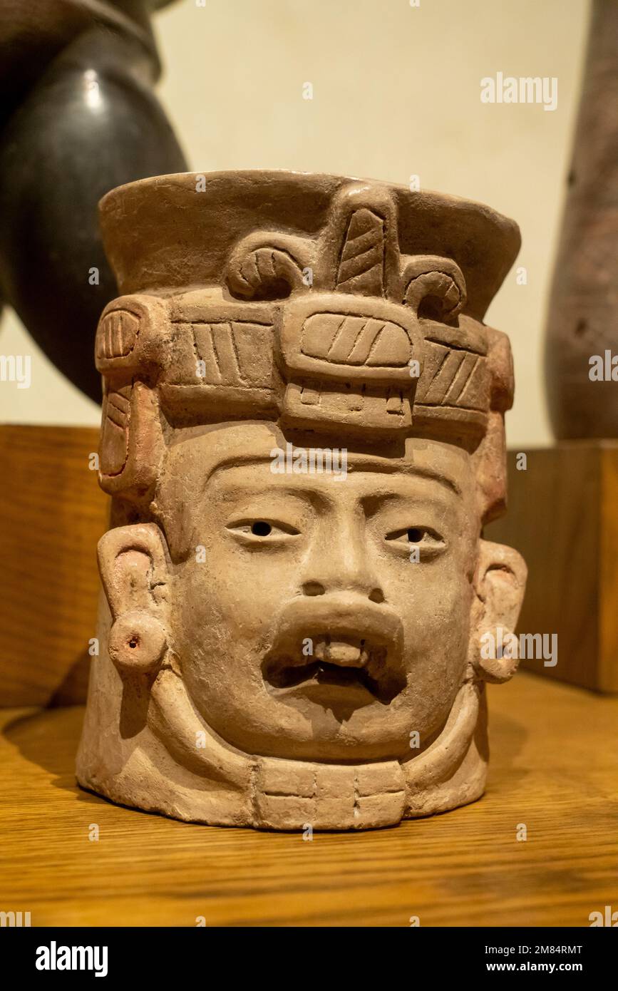 Pre-Hispanic ceramic Zapotec funerary pot with a human face in the ...