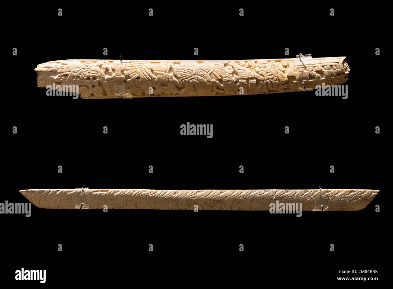 Bone with carved figures used for ritual purposes. Museum of Cultures ...