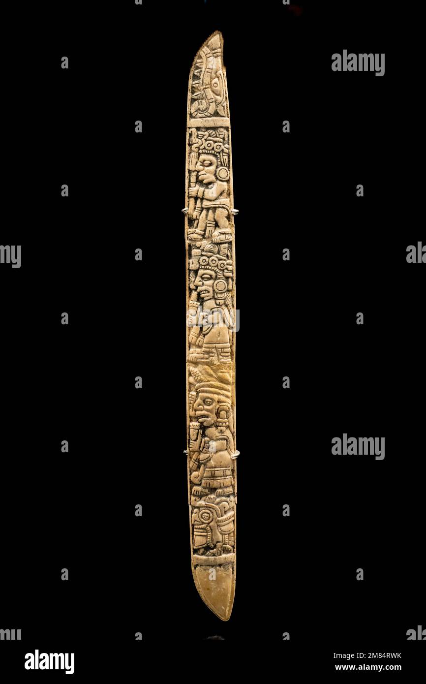 Bone with carved figures used for ritual purposes. Museum of Cultures ...