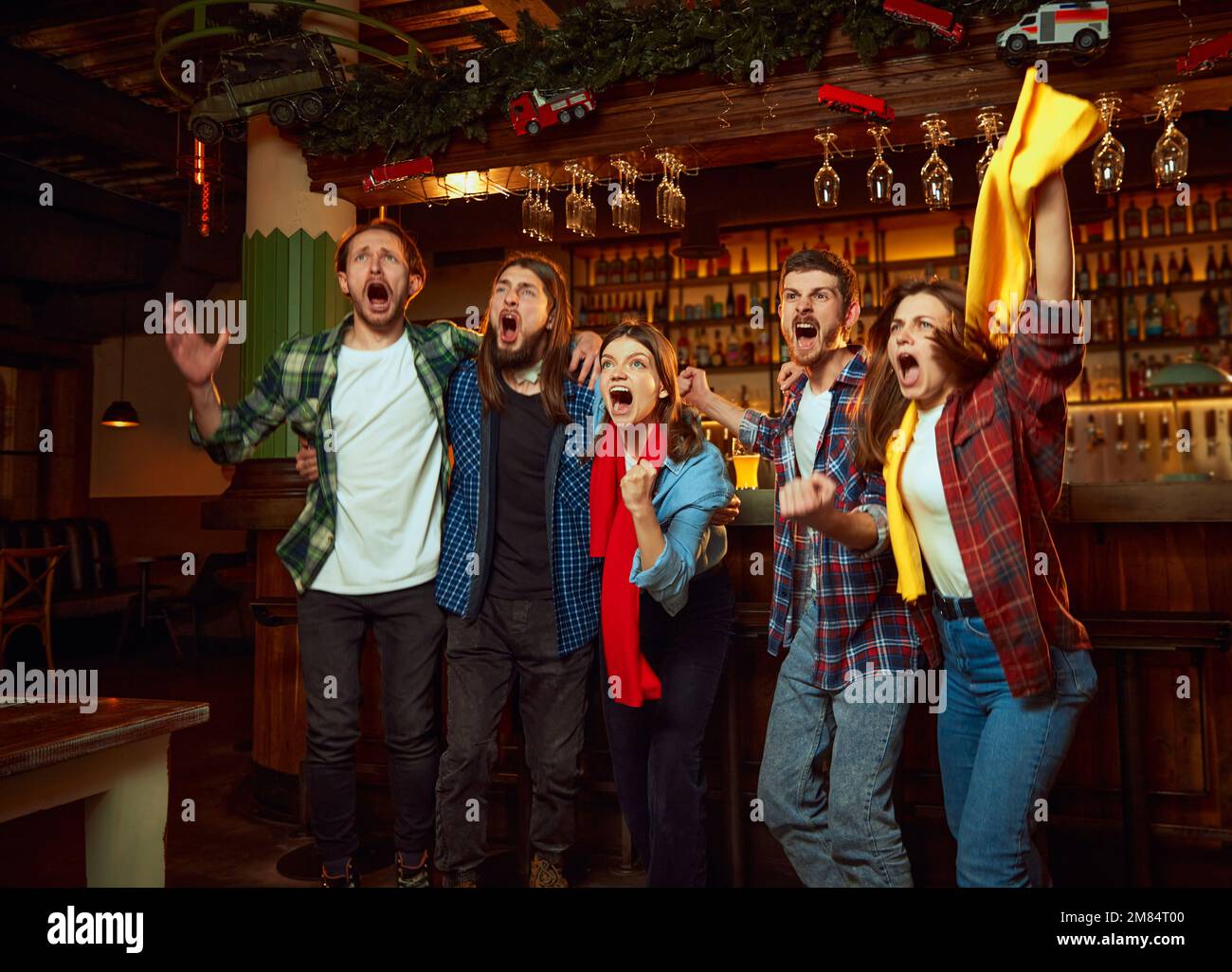 Excited, happy men and women, friends watching match, championship in ...