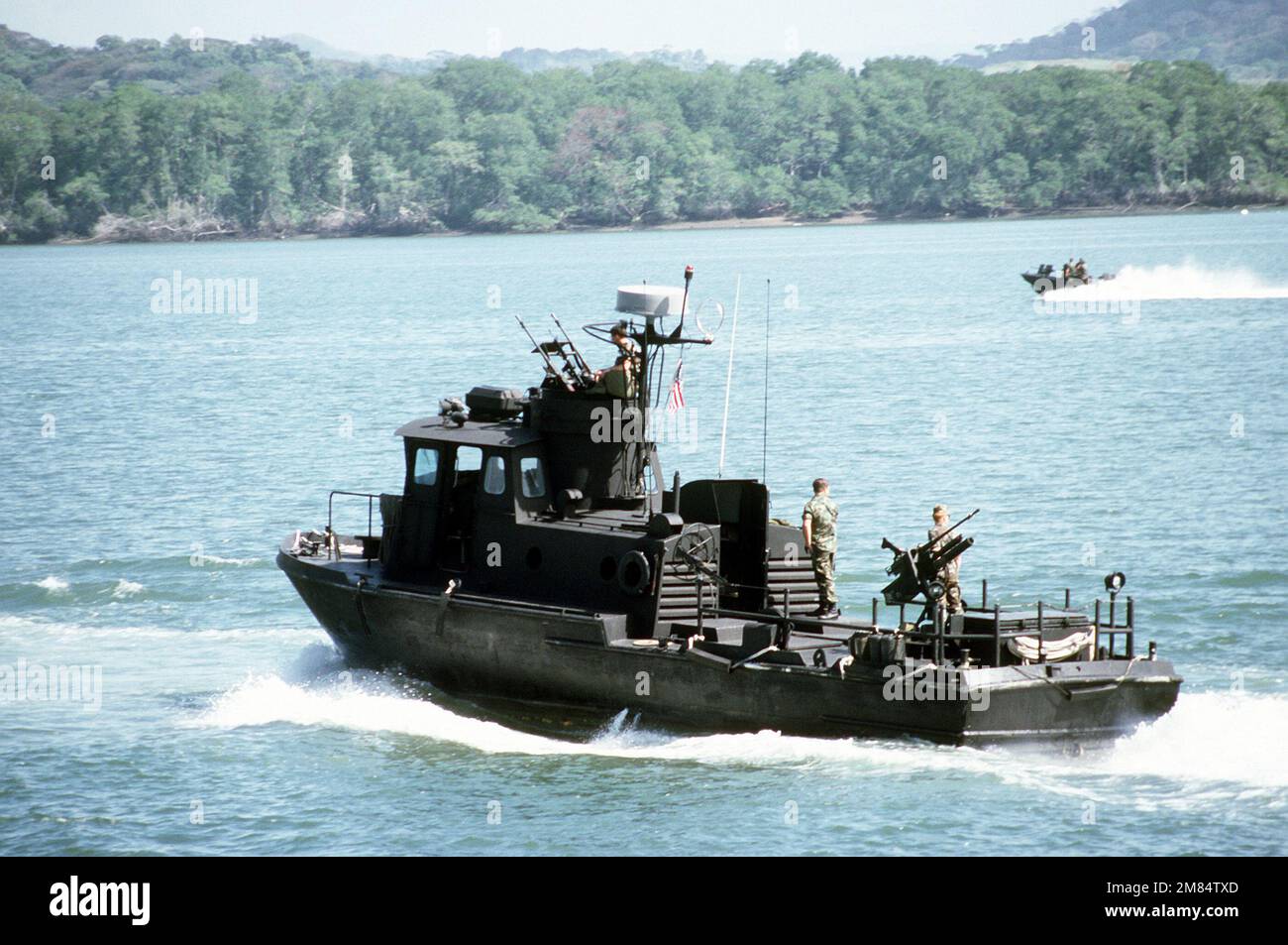 Members of Reserve Special Boat Unit 22 patrol the waters near Rodman ...