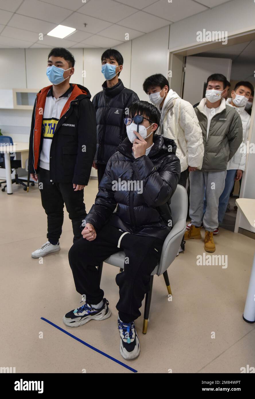 Fuyang, China. 12th Jan, 2023. A young man undergoes eye vision ...