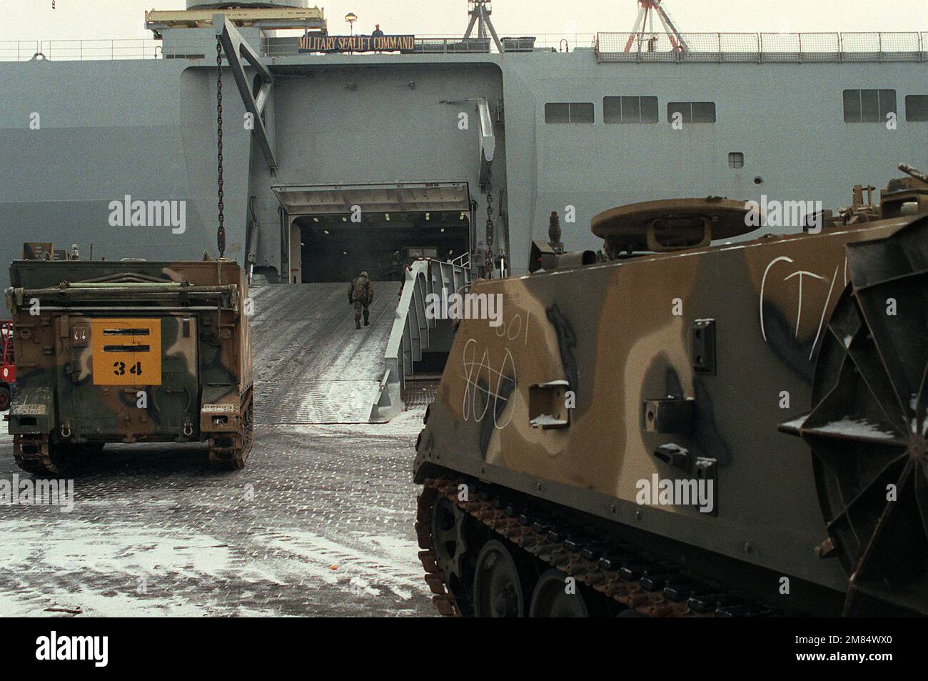 An M-577 command post vehicle and an M-106 mortar carrier, foreground ...
