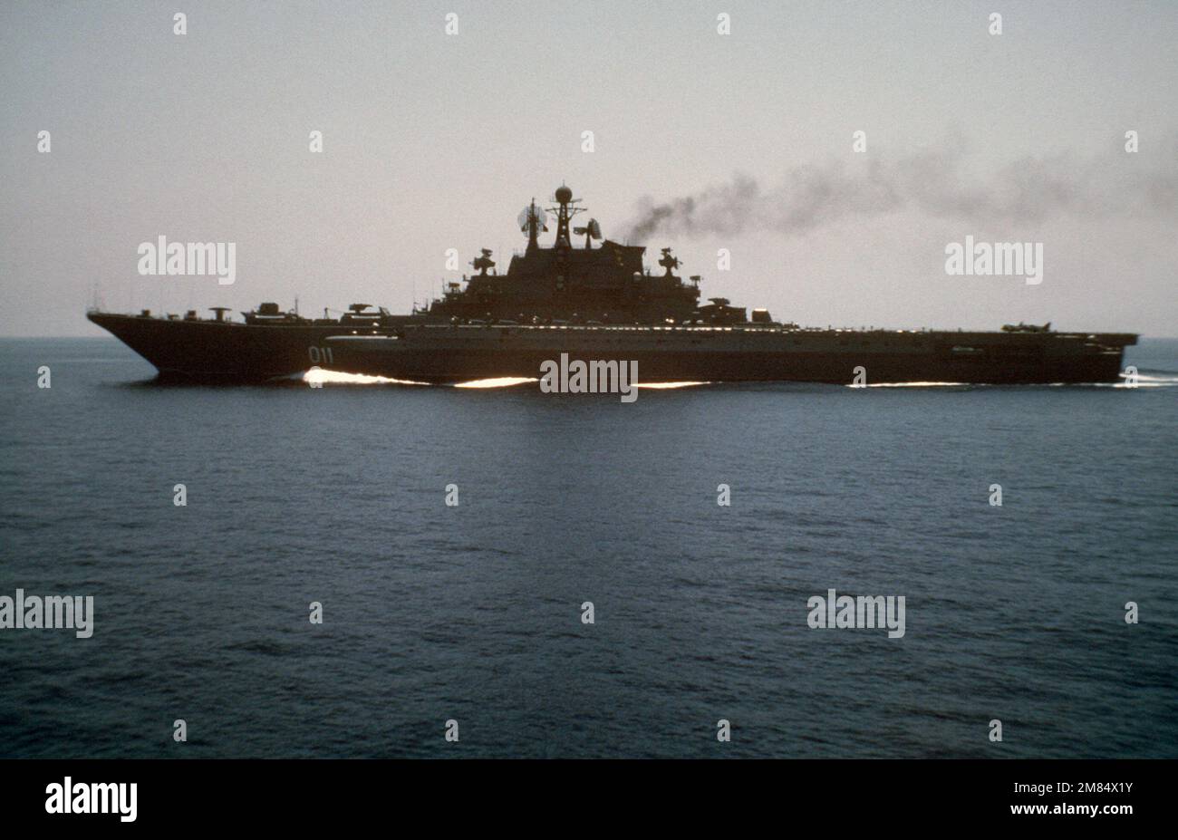 A port beam view of the Soviet aircraft carrier MINSK (CVHG) underway ...