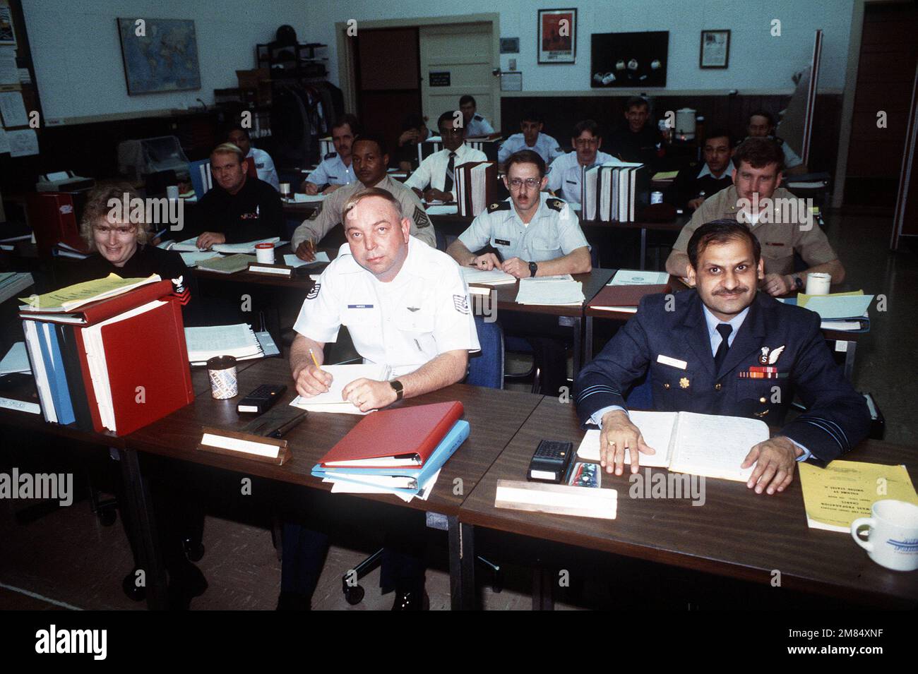 U.S. and foreign military personnel attend a class at the Air Force ...