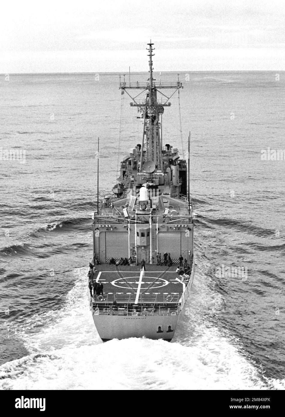 An elevated stern view of the guided missile frigate USS VANDEGRIFT ...