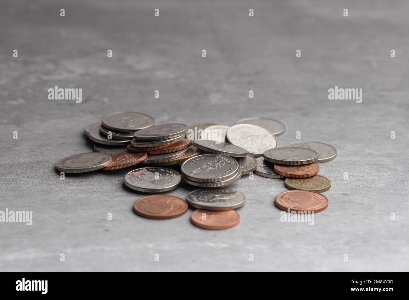 Coins on gray background. Investment finance concept Stock Photo - Alamy